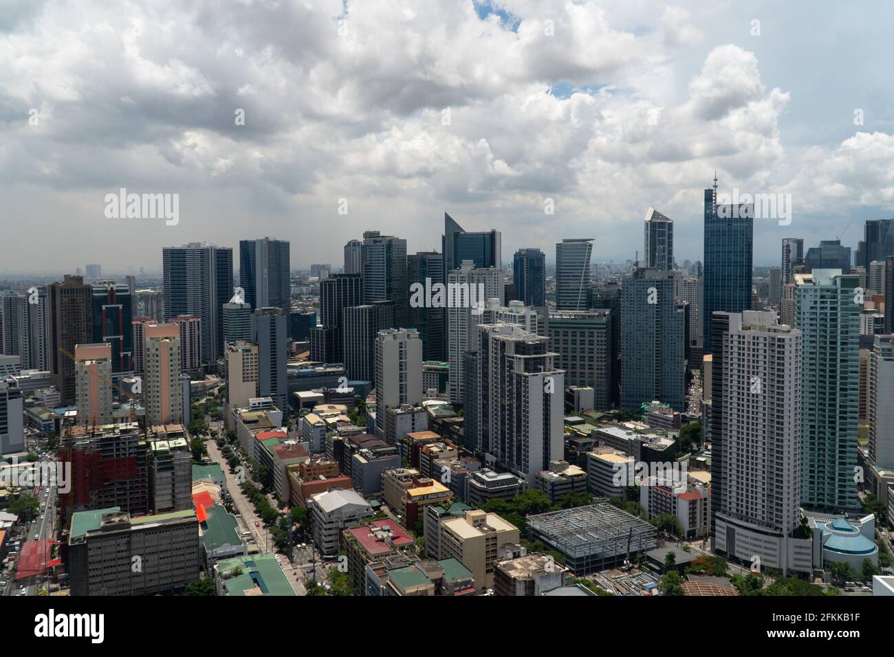 Manila city with skyscrapers, modern buildings and Makati business ...
