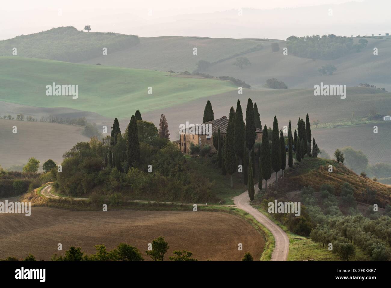 Fabulous Tuscan landscape with hills and valleys in golden morning ...