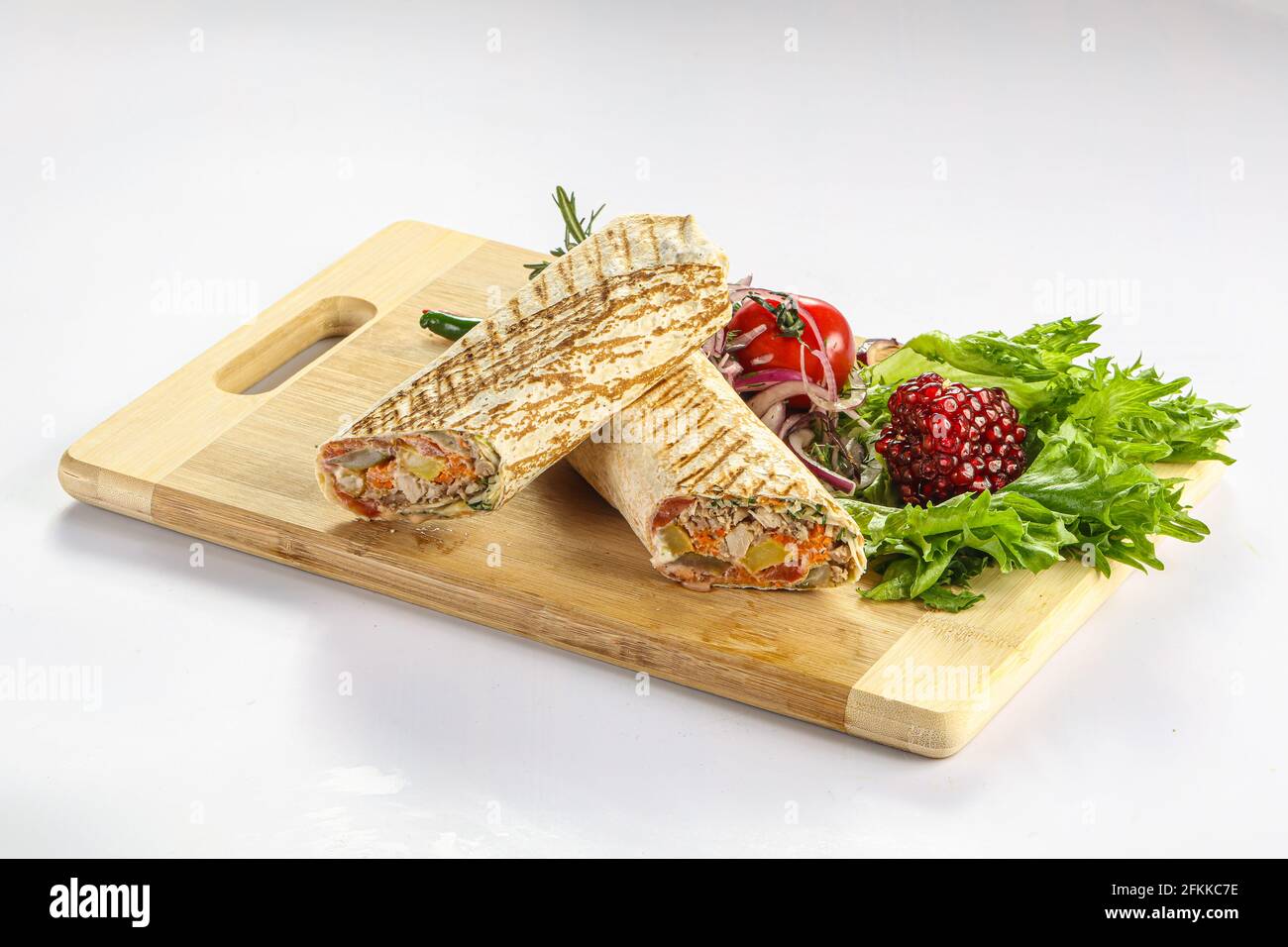 Tasty shawarma with meat, sauce and vegetables Stock Photo - Alamy
