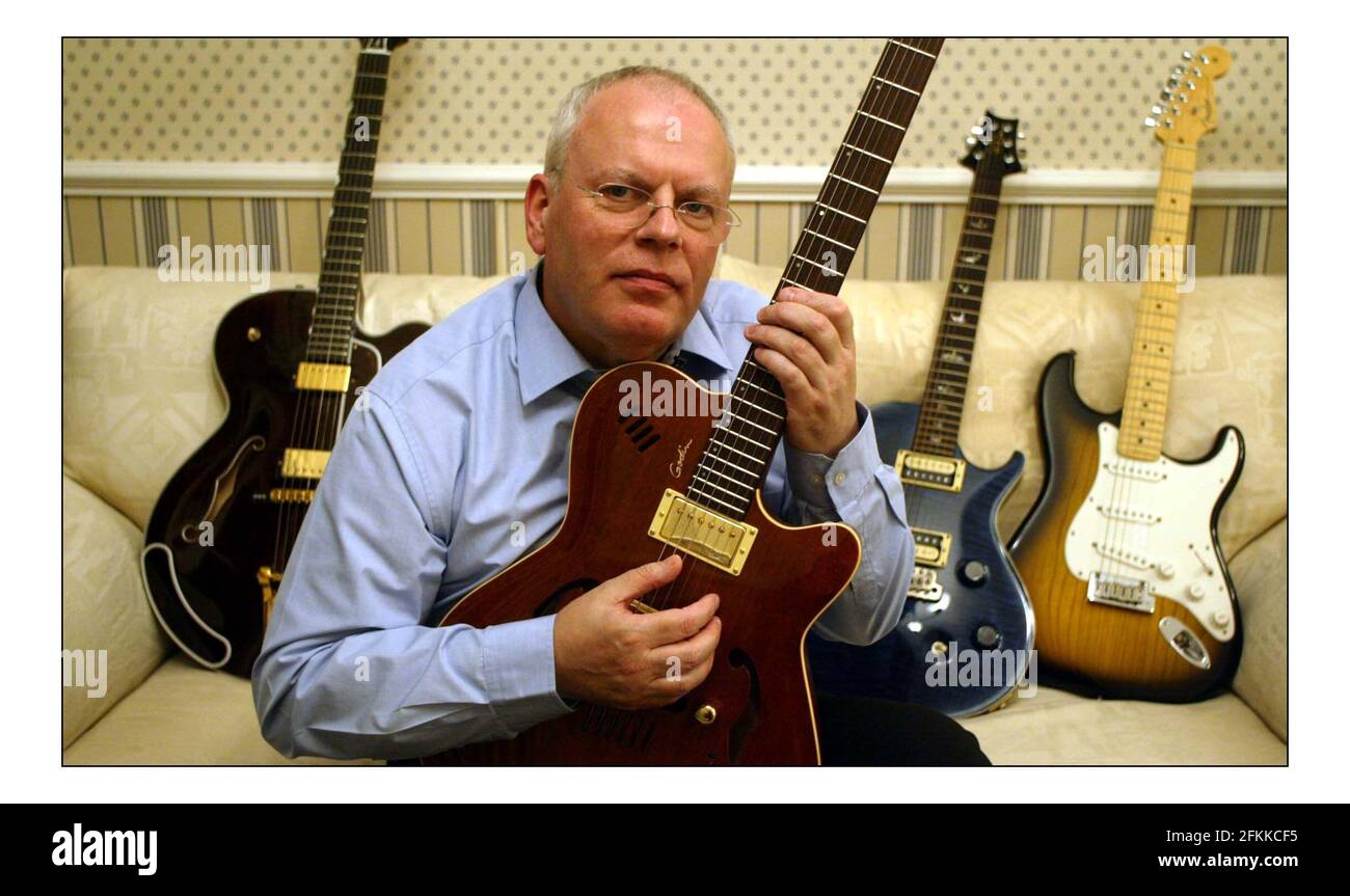 Peter Bridger with a few of his guitars.pic David Sandison 1/2/2005 ...