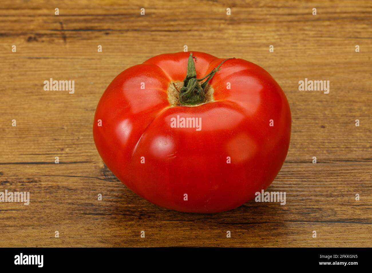 Ripe big juicy red tomato for cooking Stock Photo - Alamy