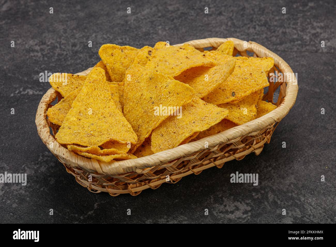 Mexican crunchy corn nachos triangle heap Stock Photo - Alamy