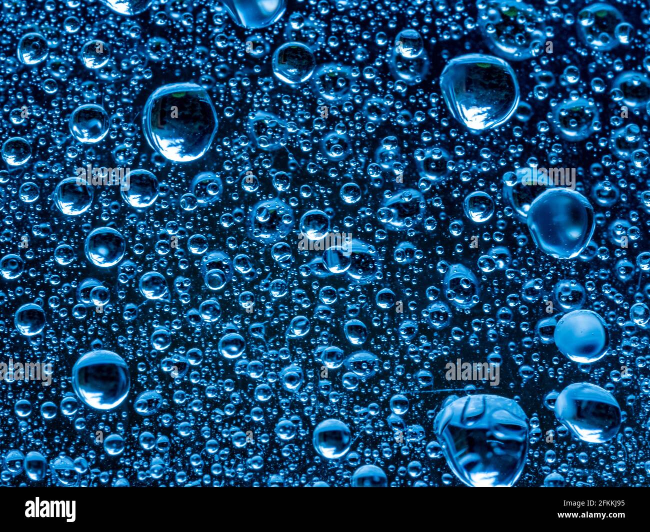 water droplets on glass abstract image blue cool light Stock Photo - Alamy