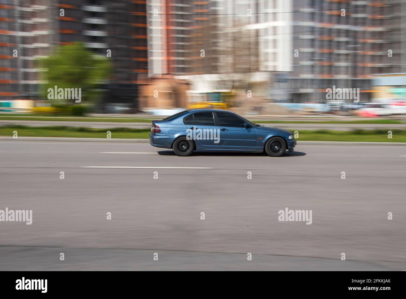 Ukraine, Kyiv - 26 April 2021: Blue BMW 3 series car moving on the ...