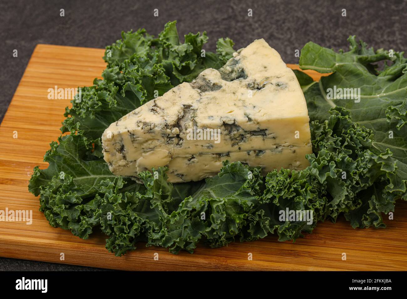 Dairy Blue cheese triangle with mold Stock Photo - Alamy