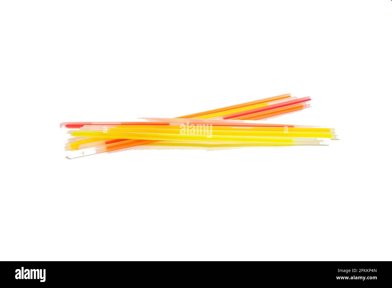 Multicolored neon sticks isolated on white background Stock Photo - Alamy
