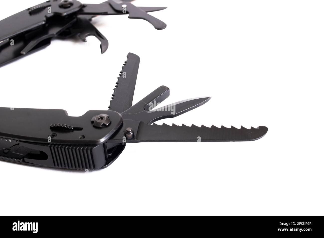 Black multi tool isolated on a white background Stock Photo - Alamy