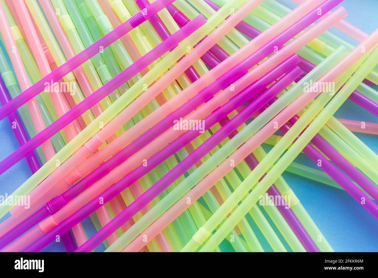 Colored plastic drinking straws on a blue background. Say no for ...