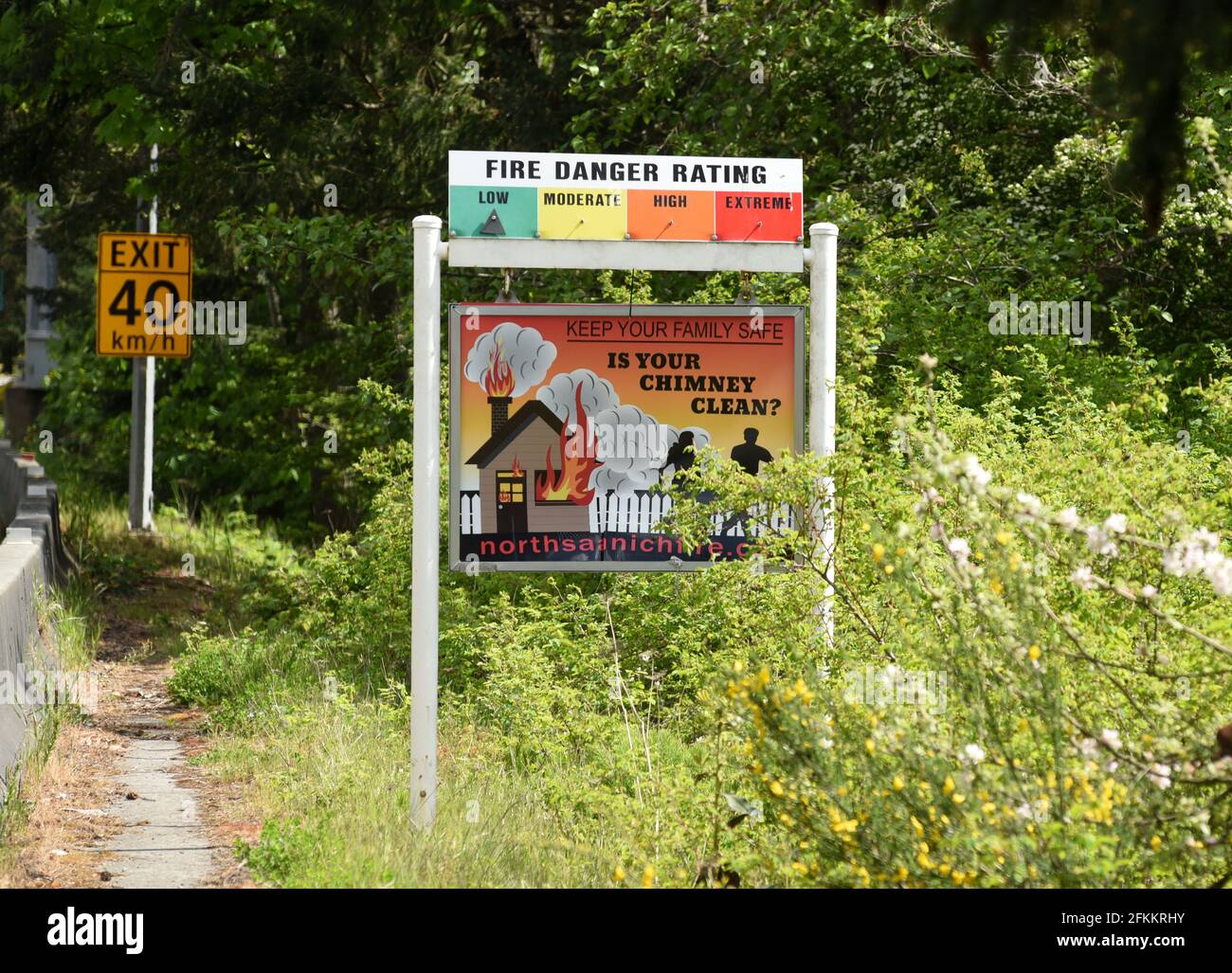 A sign shows a low fire danger rating and another warns of the dangers ...