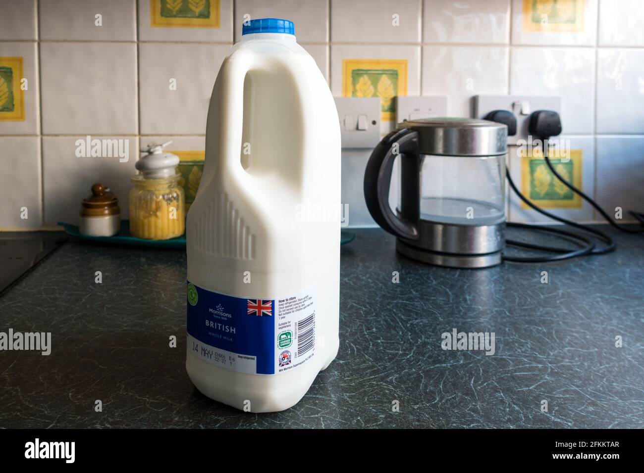Milk can on kitchen top Stock Photo - Alamy
