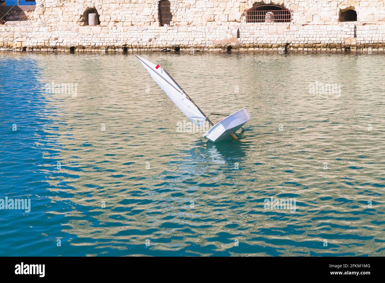 Maneuvering a laser sailing boat during sailing exercise in Heraklion ...