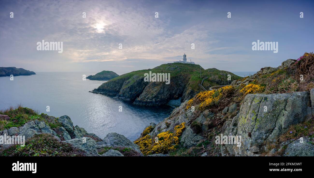 Fishguard, UK - April 20, 2021: Sunset over Strumble Head light house ...