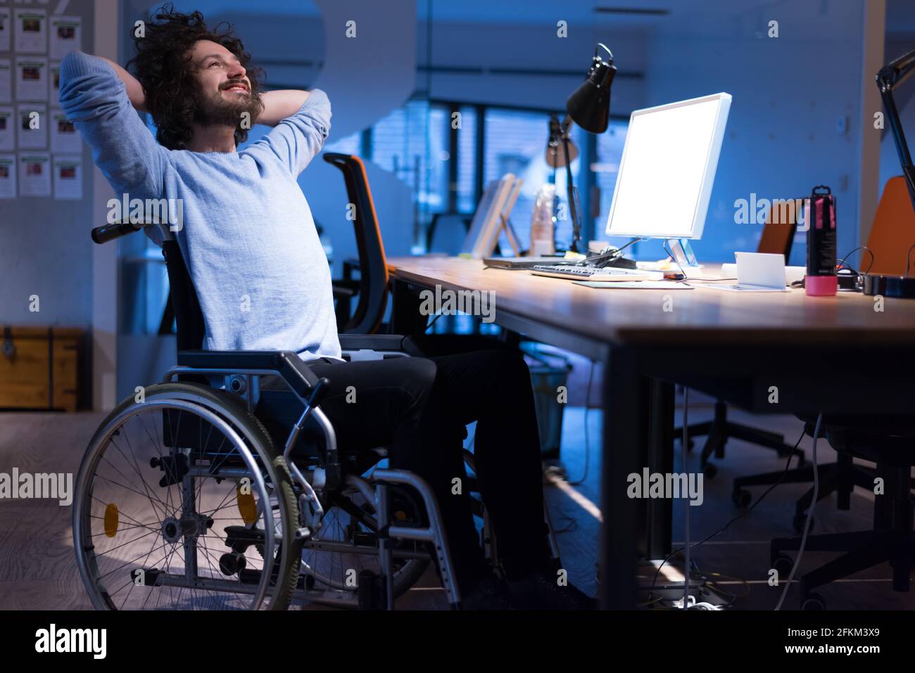 Disabled businessman working in modern office. Disability, technology ...