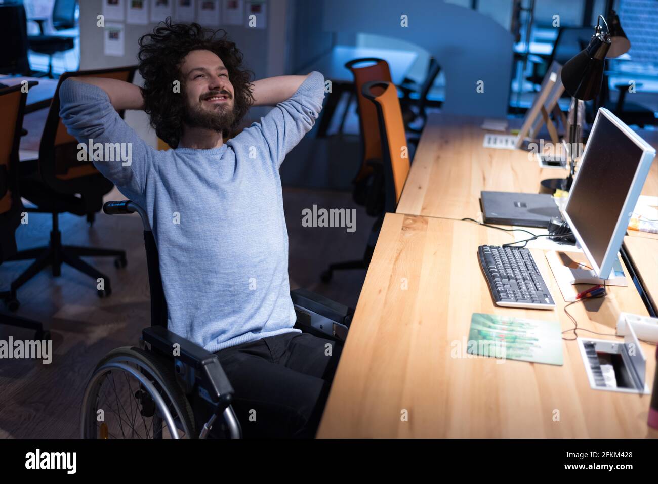 Disabled businessman working in modern office. Disability, technology ...