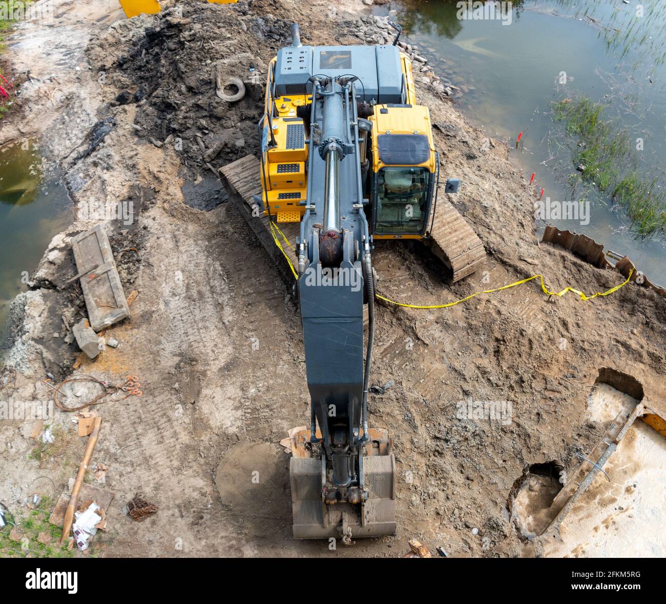 Looking down at an excavator in a construction area Stock Photo - Alamy