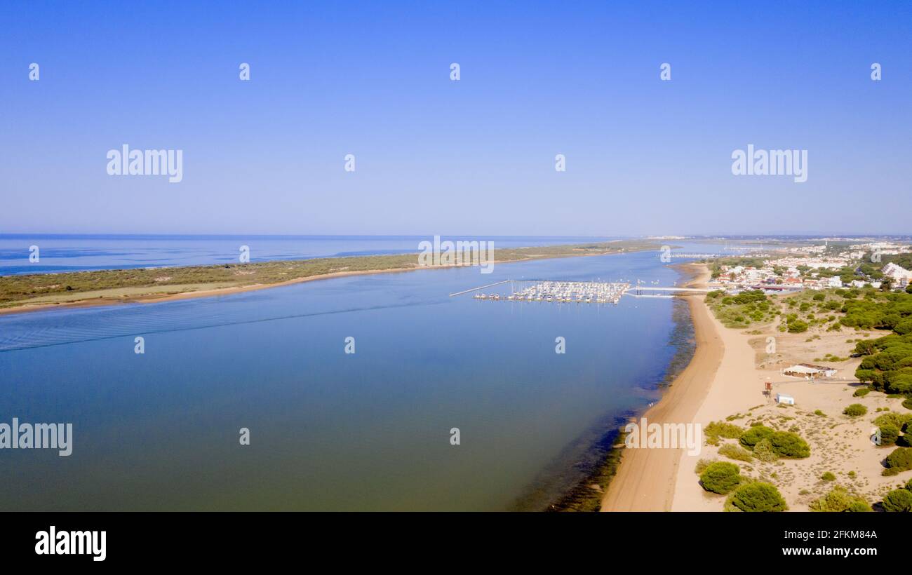 An aerial view of the sandy beach and the port in the sea Stock Photo ...