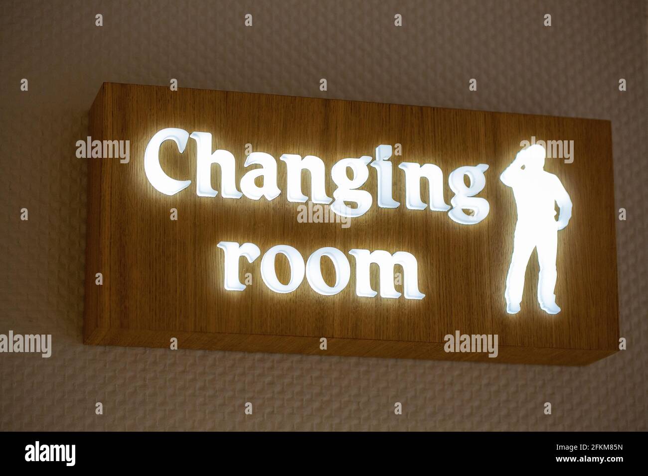 The changing room sign on the wall Stock Photo - Alamy