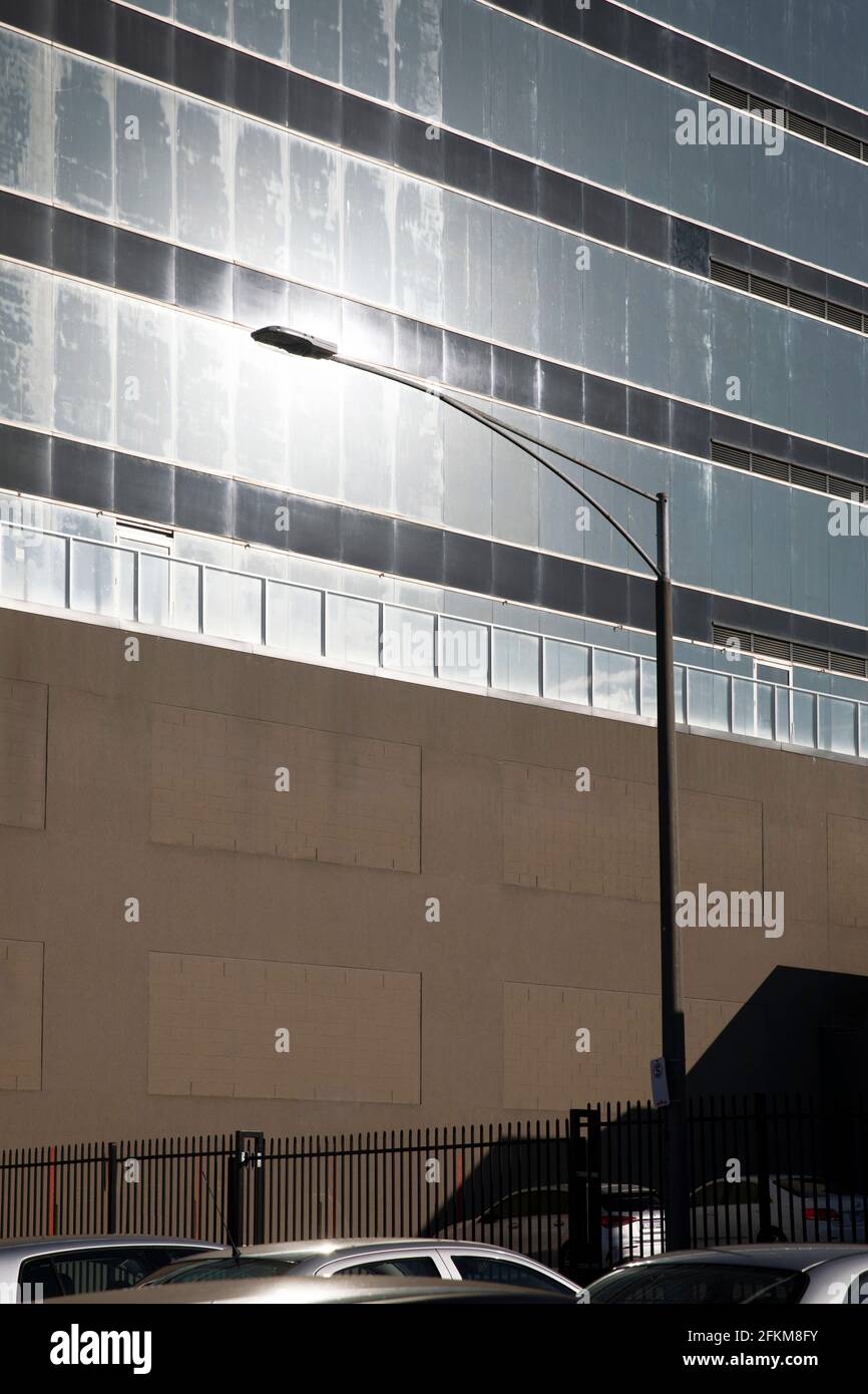 Sunlight reflection off windows behind streetlight Stock Photo - Alamy