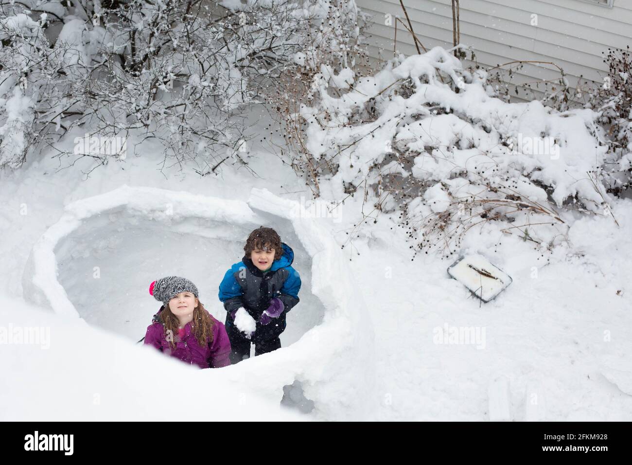 Kids Building A Snow Fort