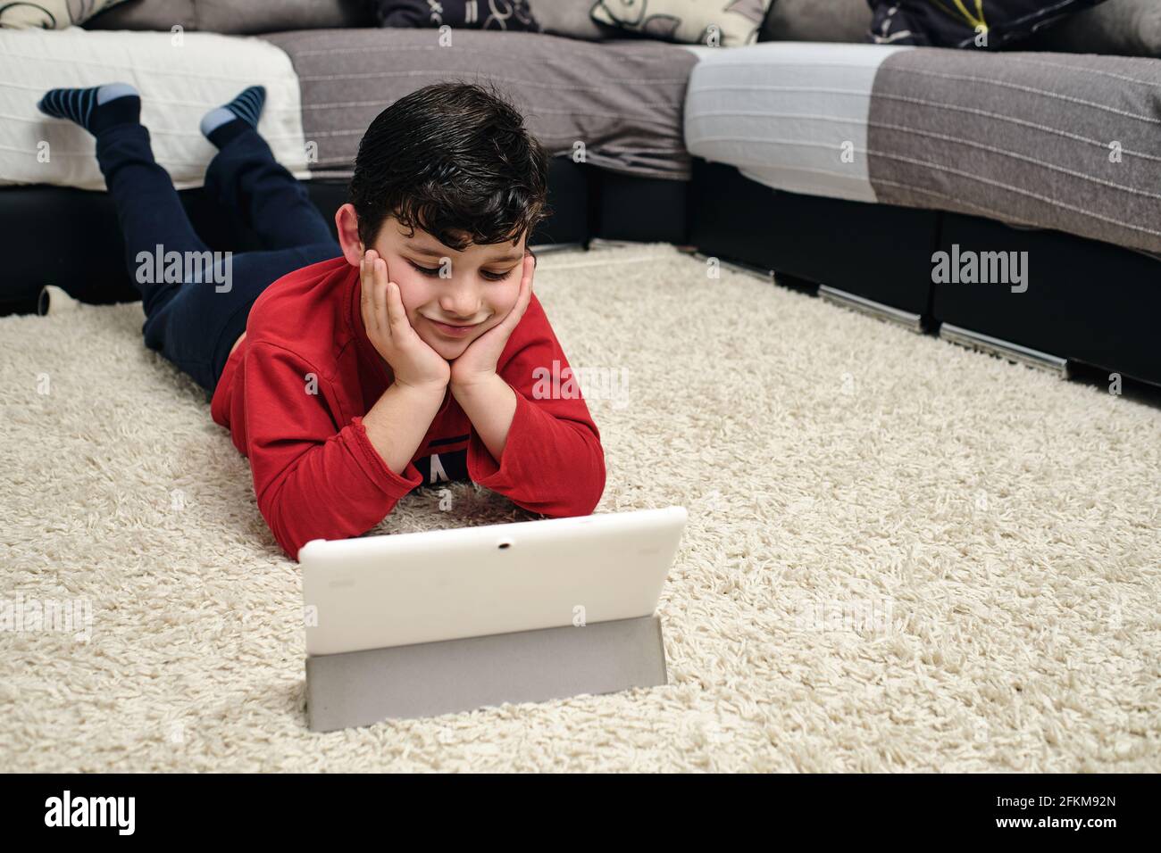 Tablet child holding screen hi-res stock photography and images - Alamy