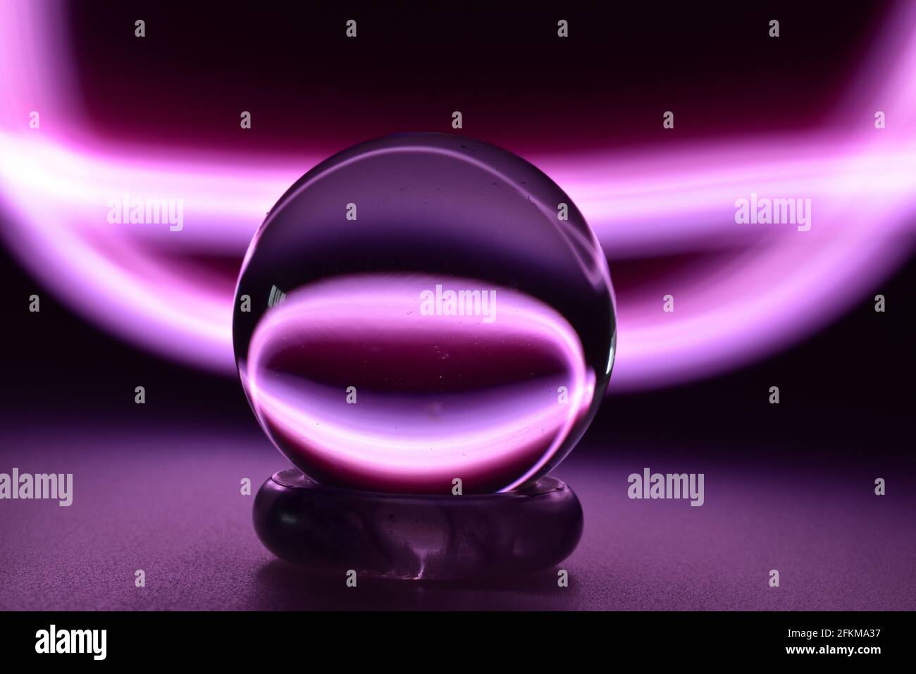 A purple transparent glass ball Stock Photo - Alamy