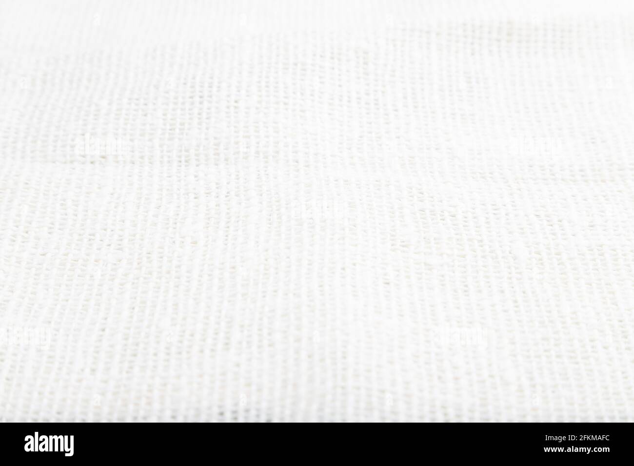 Fragment of smooth white linen tissue. Side view, natural textile ...