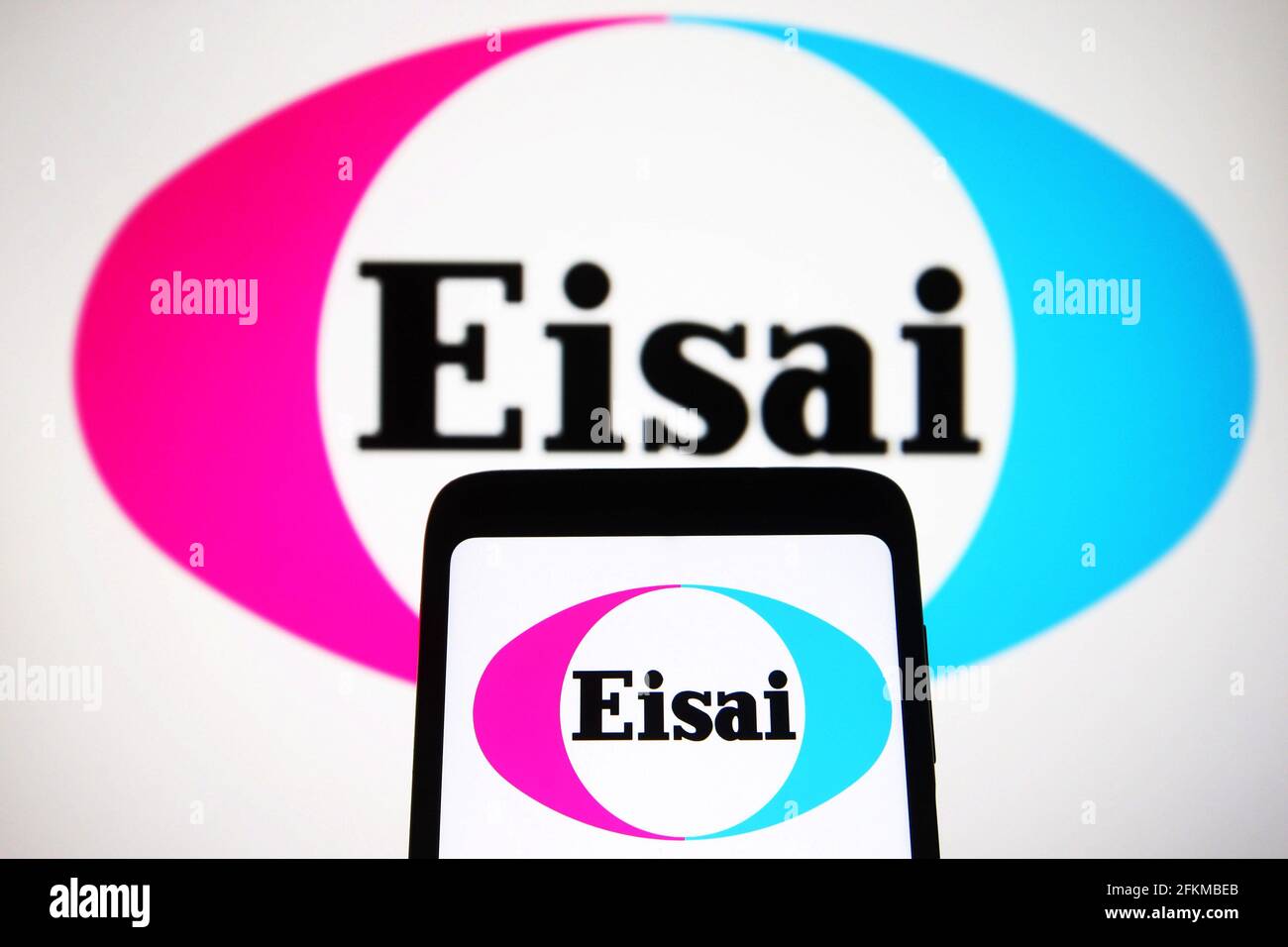 In this photo illustration an Eisai logo of an Japanese pharmaceutical ...