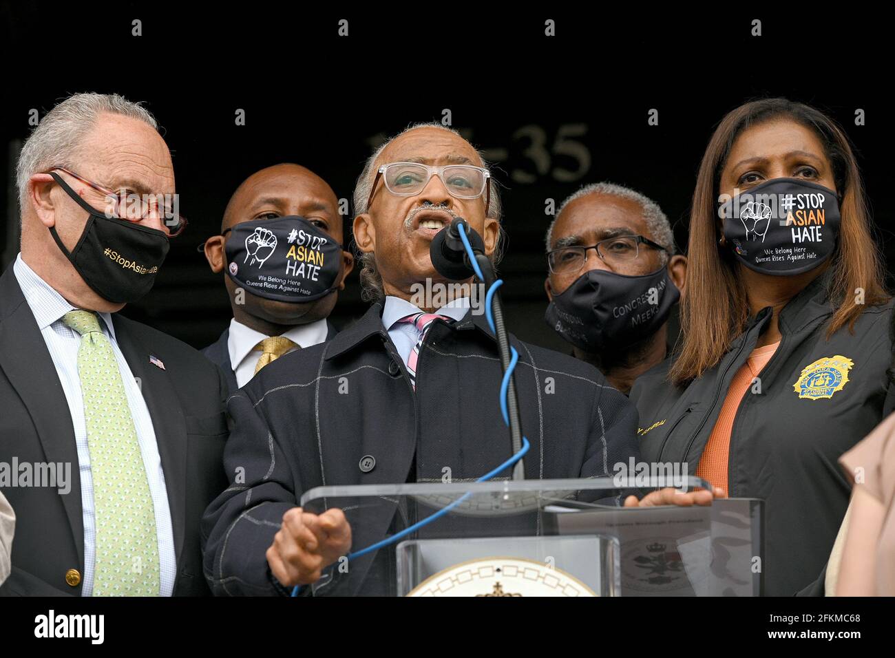 American civil rights activist Al Sharpton (at podium) is joined by (l ...