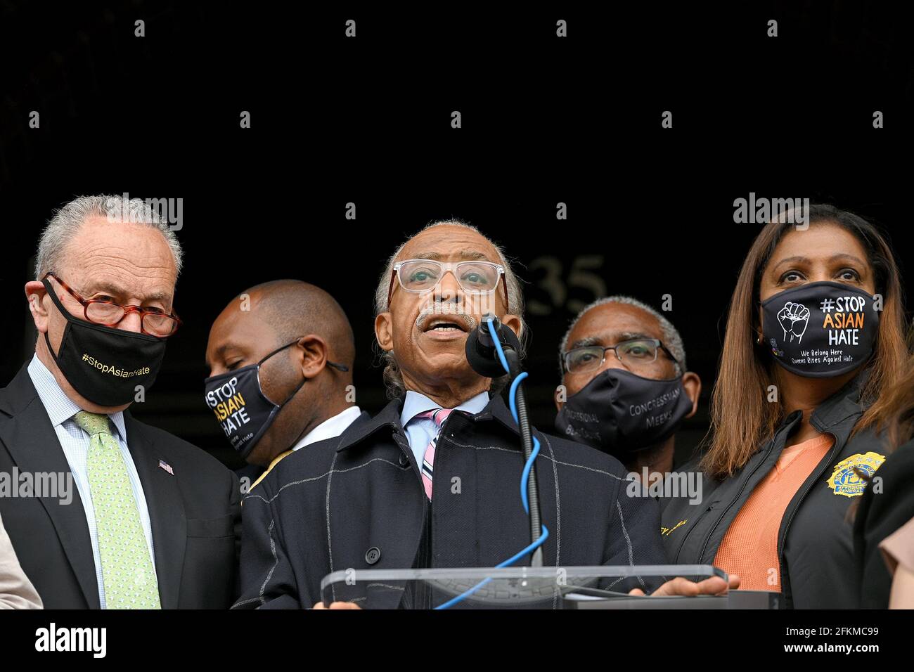 American civil rights activist Al Sharpton (at podium) is joined by (l ...