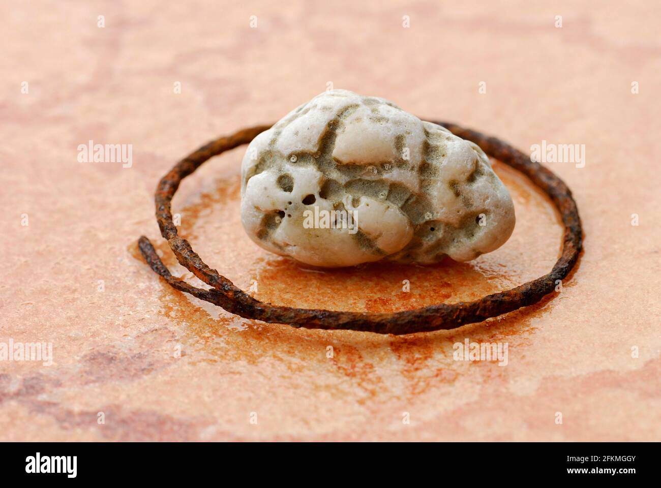 Stone and rusty ring, rusty, rusty ring Stock Photo - Alamy