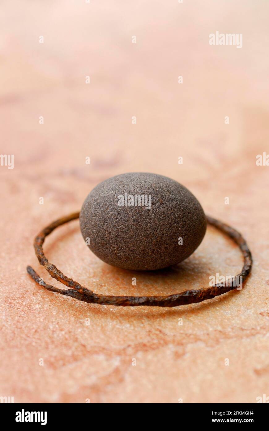 Stone and rusty ring, rusty, rusty ring Stock Photo - Alamy
