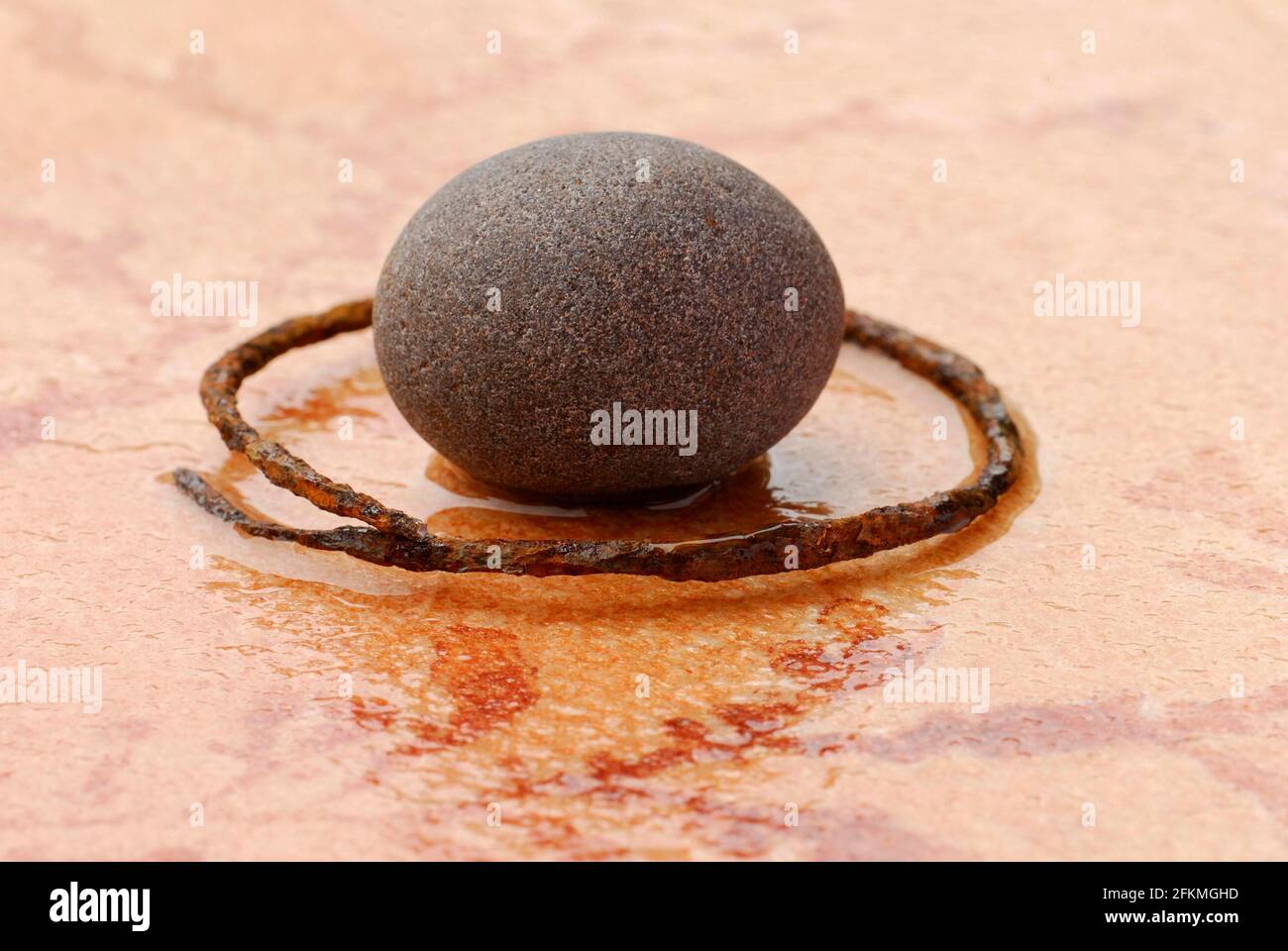Stone and rusty ring, rusty, rusty ring Stock Photo - Alamy