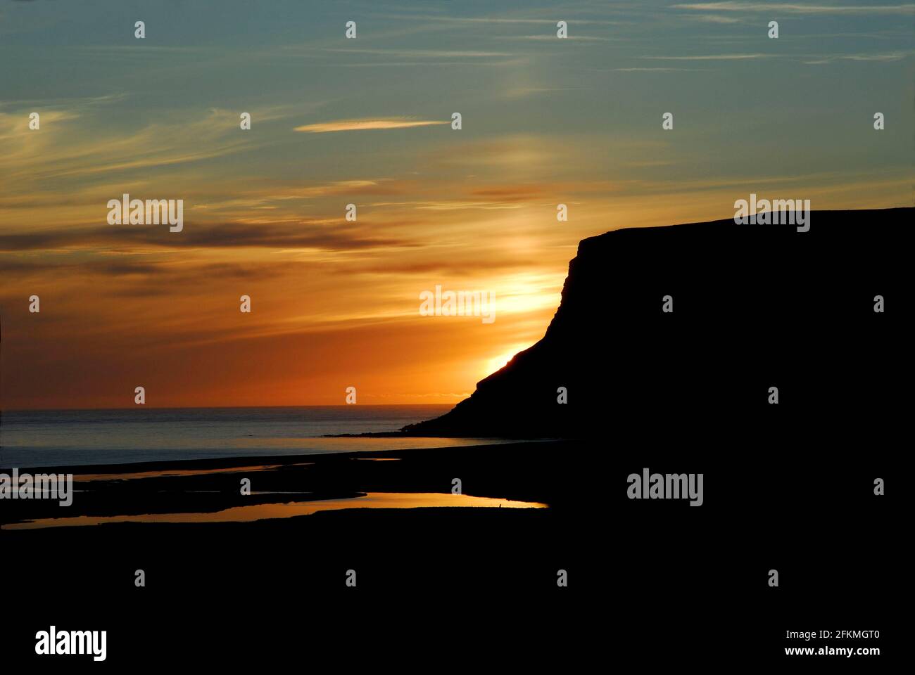 Coast in the light of the midnight sun, Iceland Stock Photo - Alamy