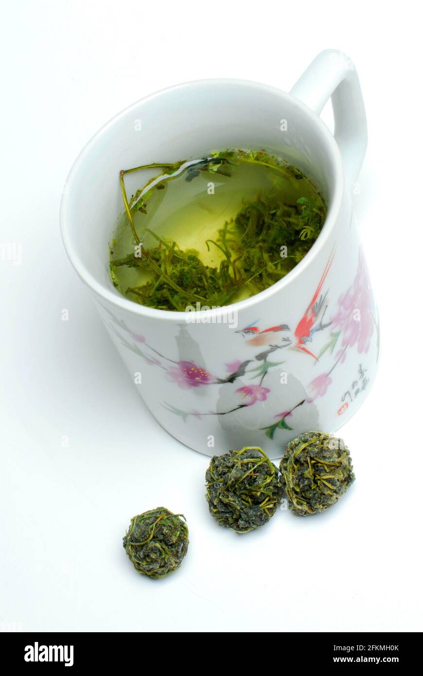 Cup of Jiao-gu-lan tea, dried balls, , female ginseng (Gynostemma ...