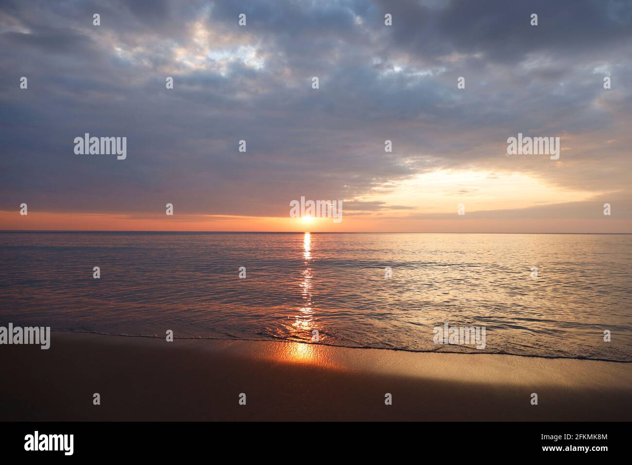 Beautiful sunset over the clam sea with cloud sky background. Sunset ...
