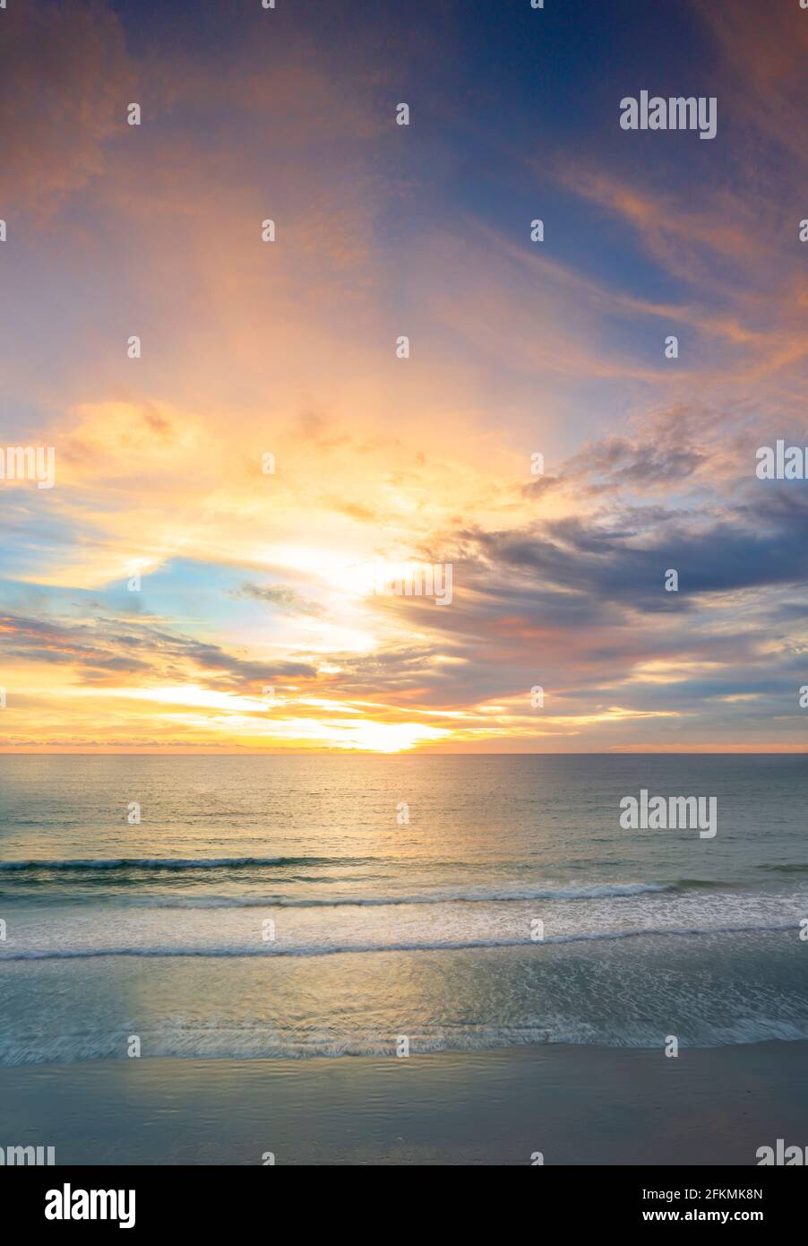 Beautiful of panorama vertical sunset over the clam sea with cloud sky ...