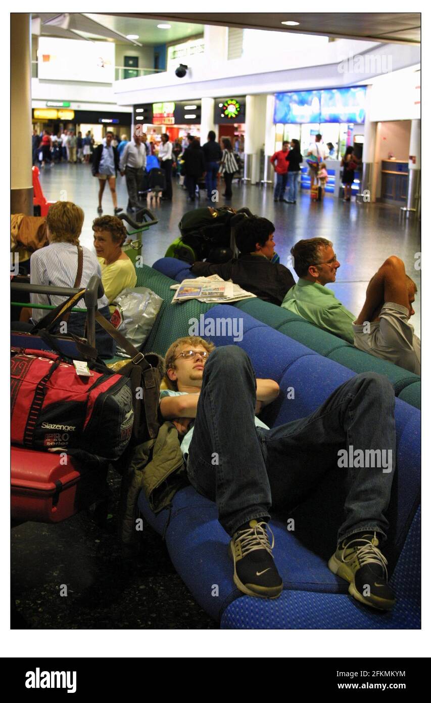 DELAYED PASSENGERS AT GATWICK AIRPORT JULY 2001 Passengers wait,rush ...