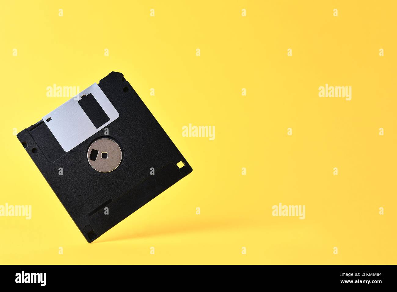 Floppy disk on yellow background. Retro computer diskette Stock Photo ...