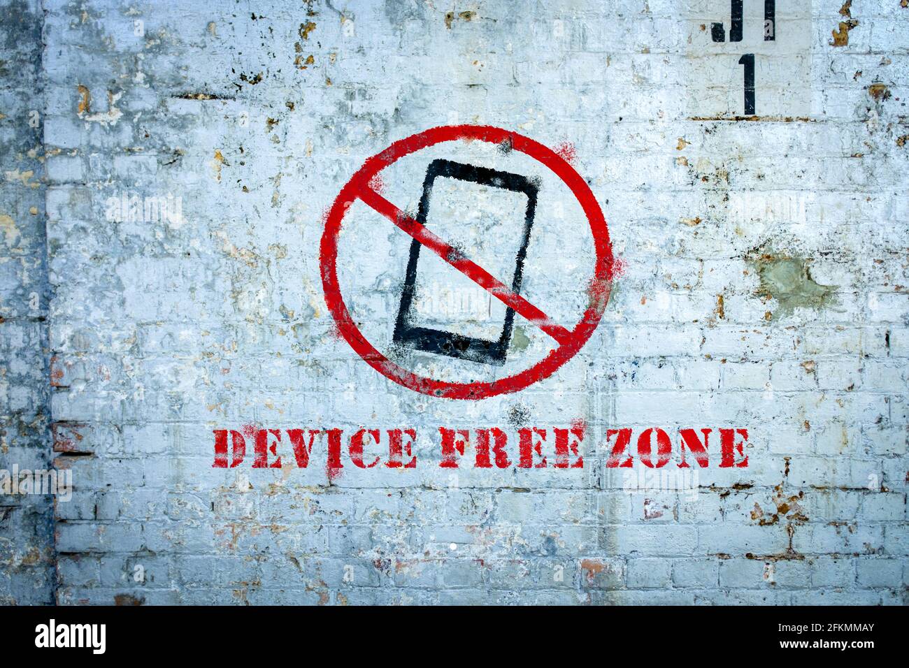 device free zone symbol and text on old wall. Encouraging digital down ...