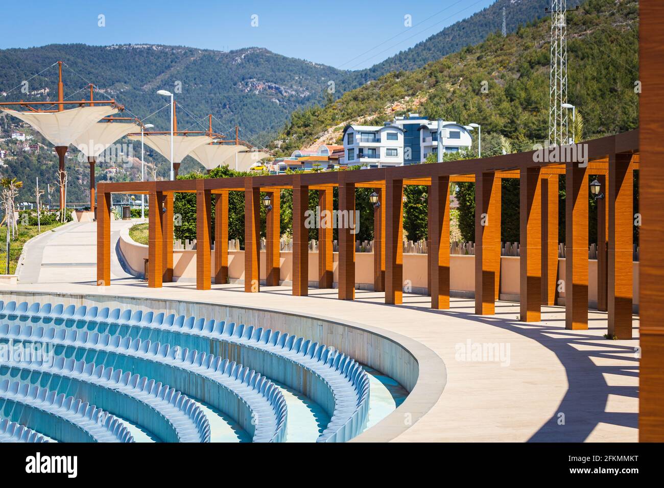 Modern outdoor amphitheater with rows of blue chairs against the ...