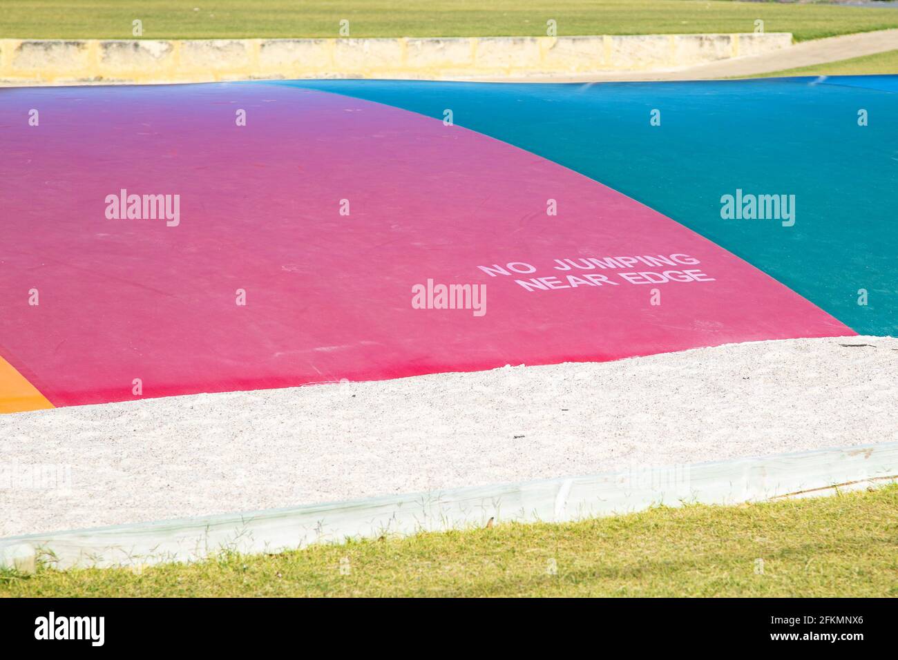 Colourful jumping pillow for children to bounce on Stock Photo - Alamy