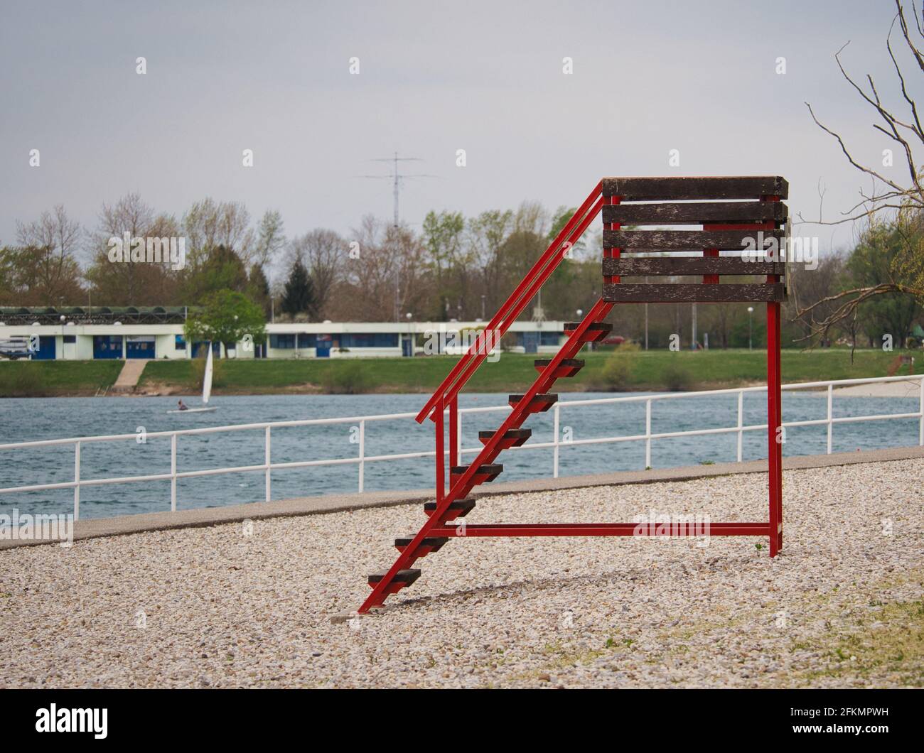 Selective focus of a red-painted lifeguard post on the sandy beach ...