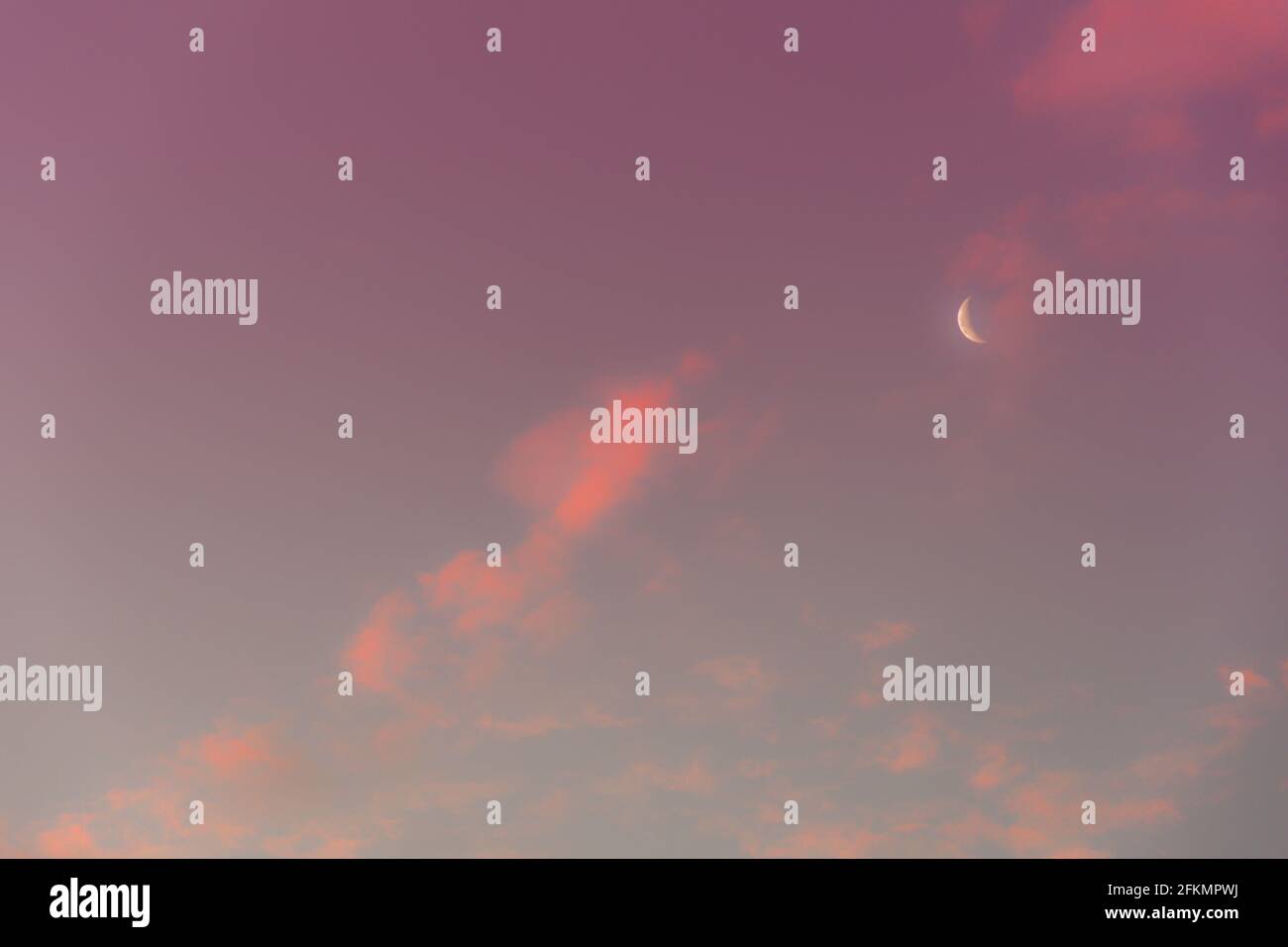 Beautiful scenery of an indigo sky with a crescent moon during sunset ...