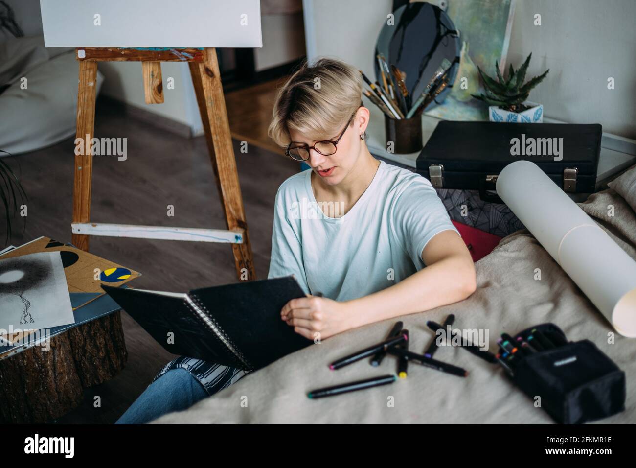 Woman artist drawing sketch. Female artist creates a sketch Stock Photo ...