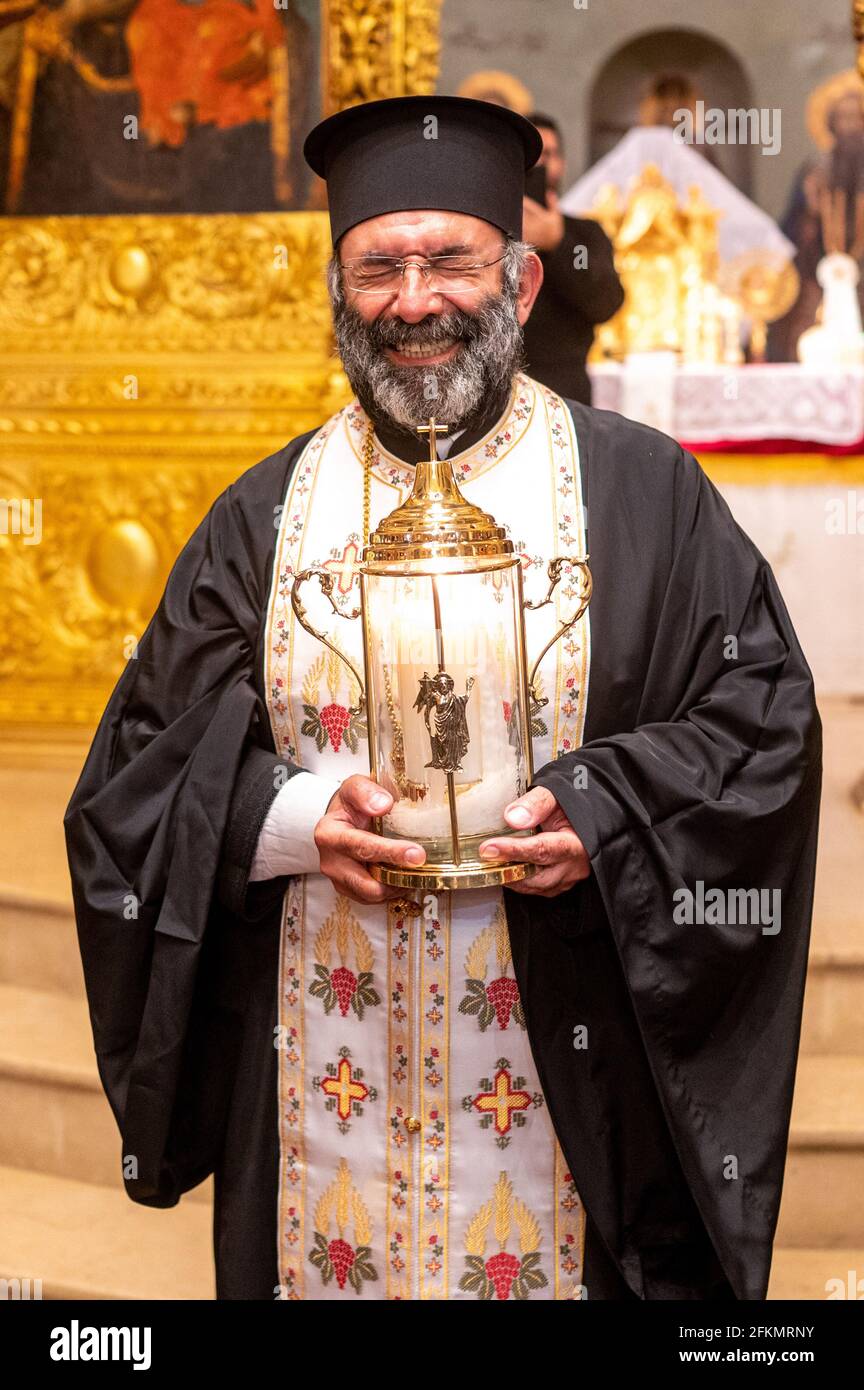Father Nektarios Khairallah, Lebanese Greek Orthodox priest carries the ...