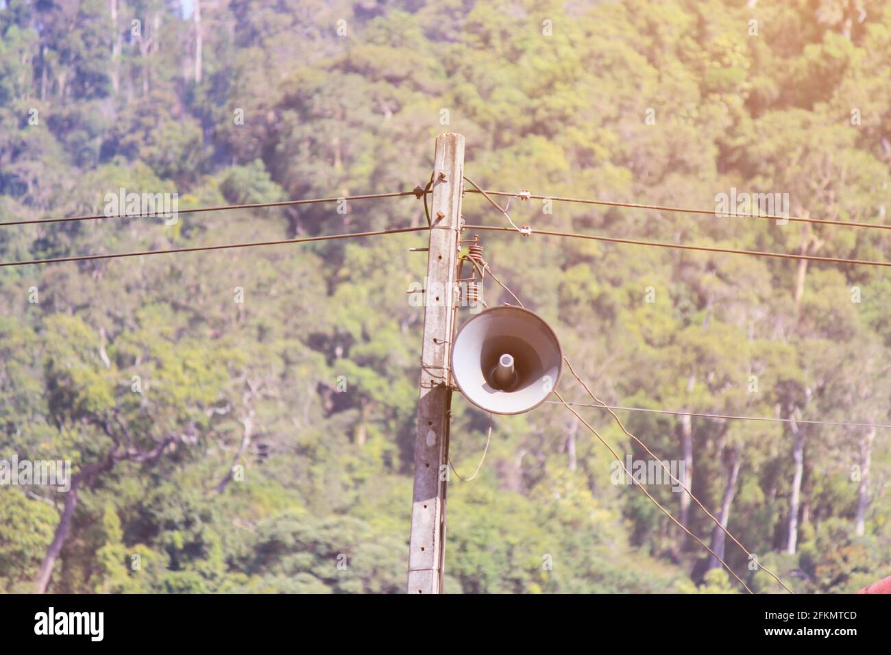 A big speaker on a pole to make an announcement in country side Stock ...