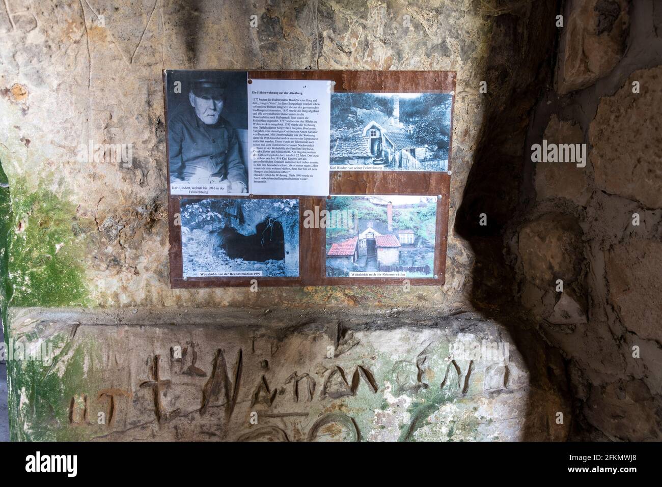 Halberstadt, Germany. 28th Apr, 2021. In a cave dwelling hangs a photo ...
