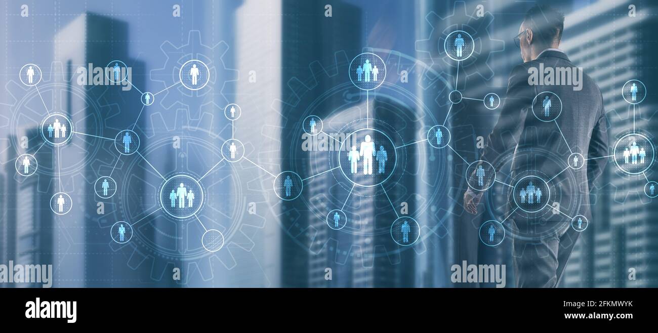 Teamwork. Gears on the background of a modern office building and ...