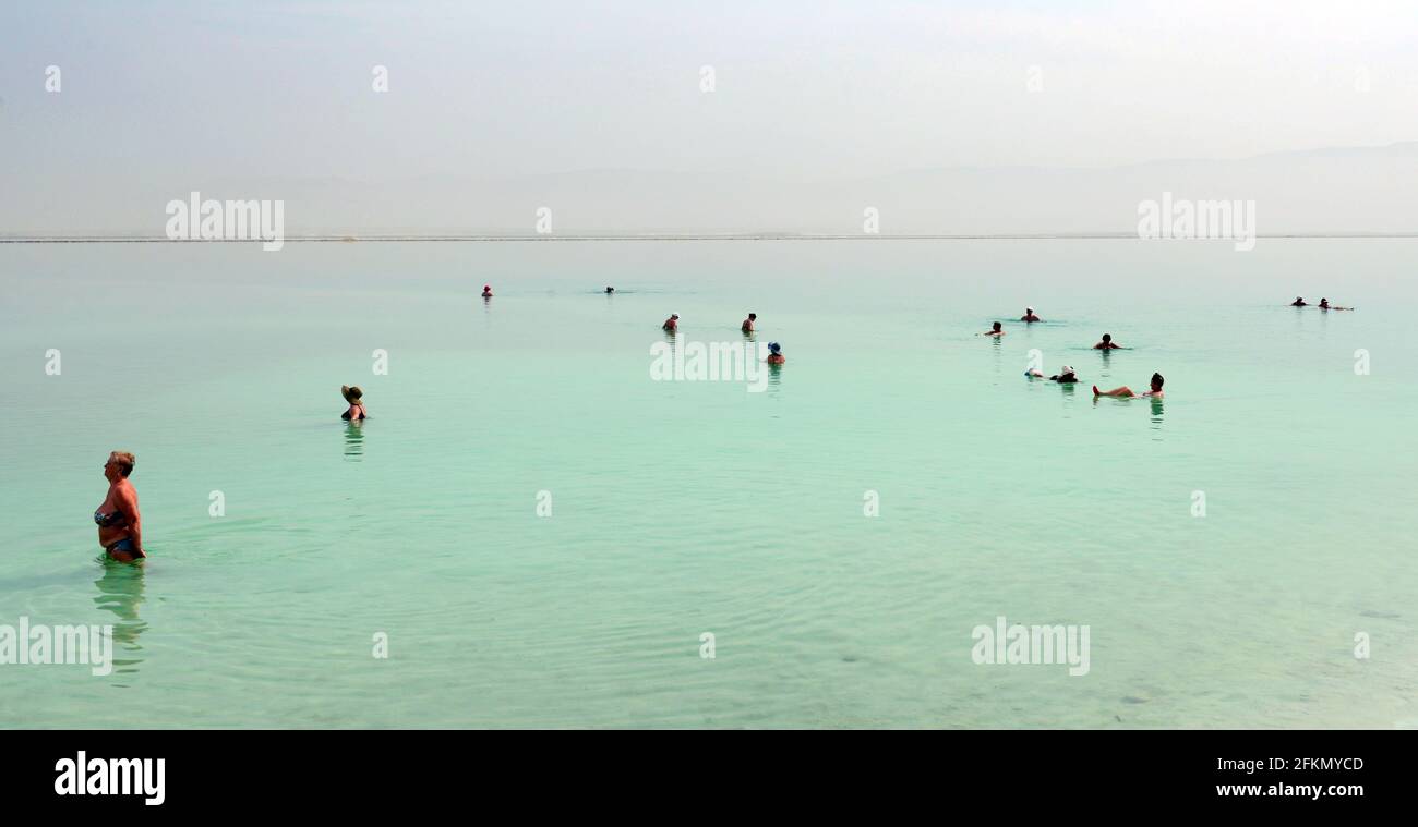 Tourist floating in the water of the Dead Sea in Israel Stock Photo - Alamy