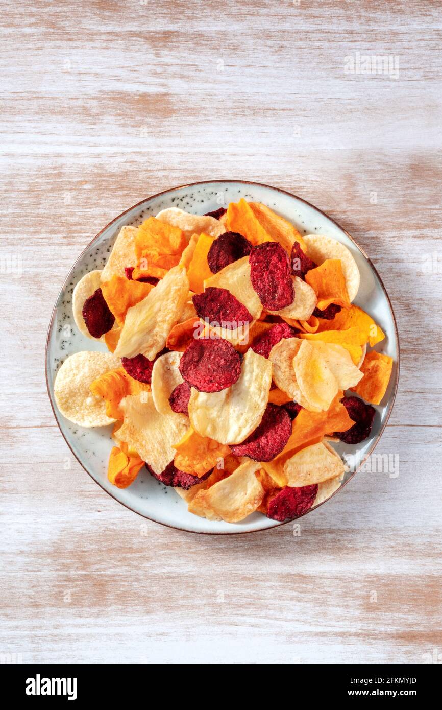 Vegetable chips mix, top shot on a plate, a healthy vegan snack Stock ...